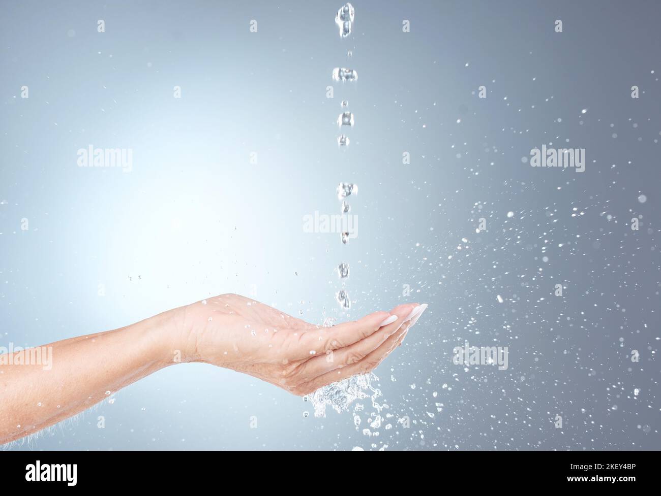 Water, stream and isolated hand in studio on gray background for ...