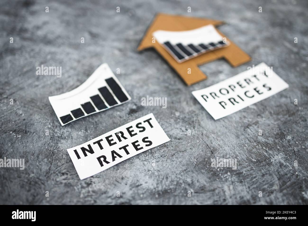 interest rates increasing and property prices dropping conceptual image ...