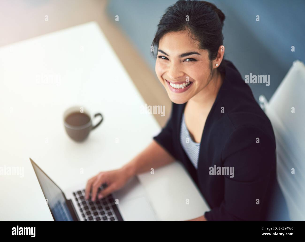 Im on the job. High angle portrait of an attractive young businesswoman ...