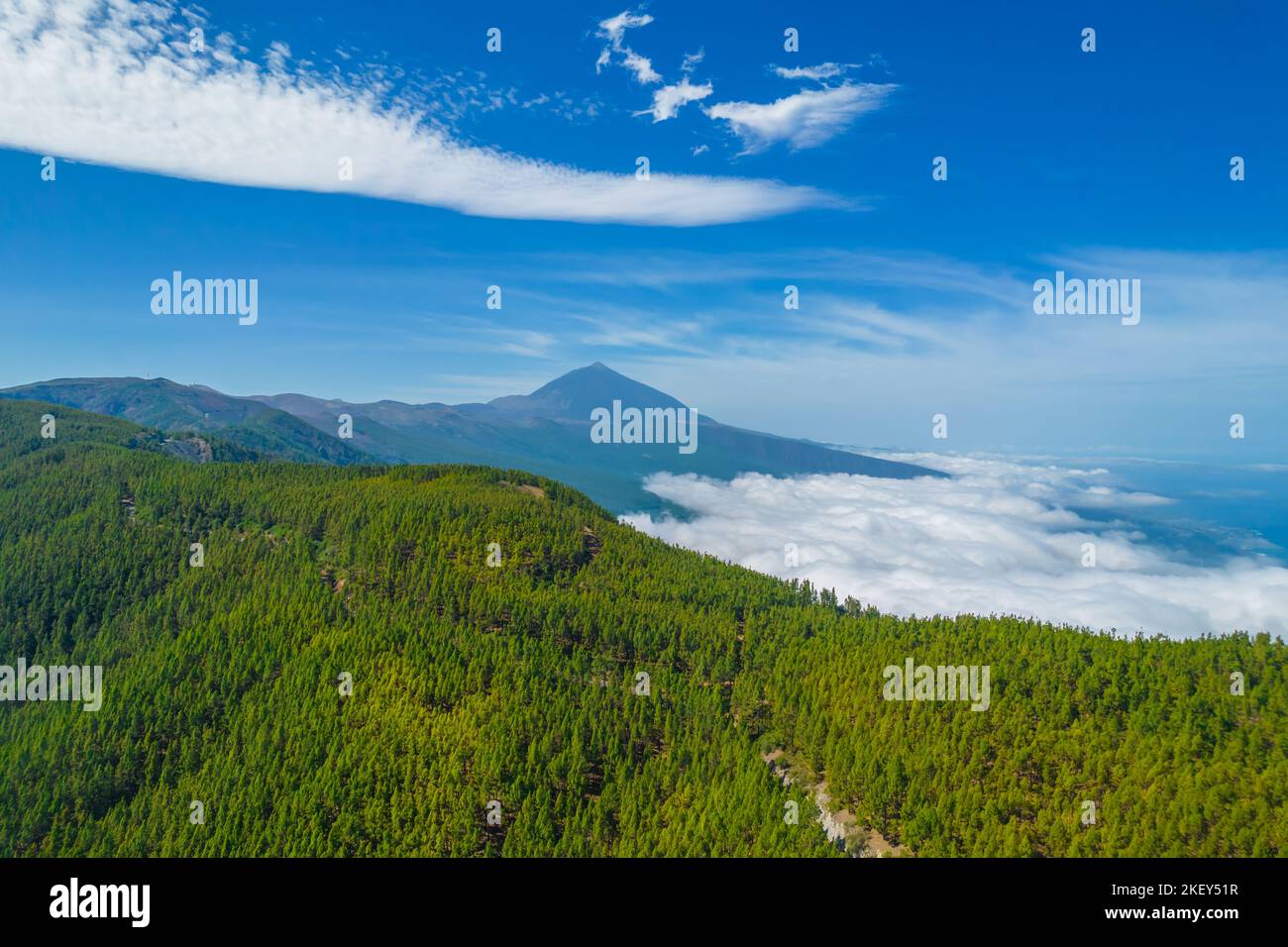 Aerial photo of mount Teide in the distance above the clouds. Volcano ...