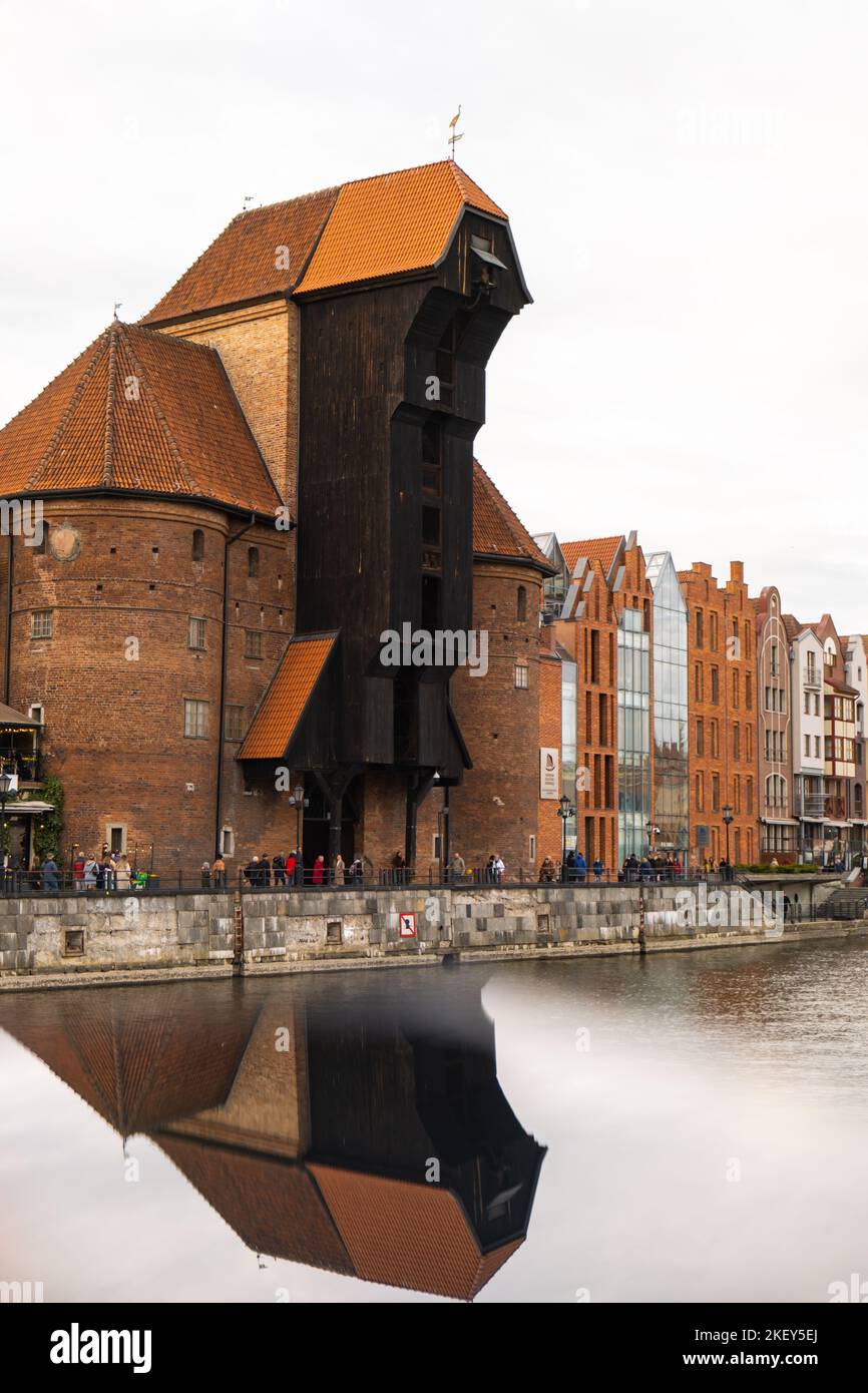 Ancient crane - zuraw Old town in Gdansk. The riverside on Granary ...