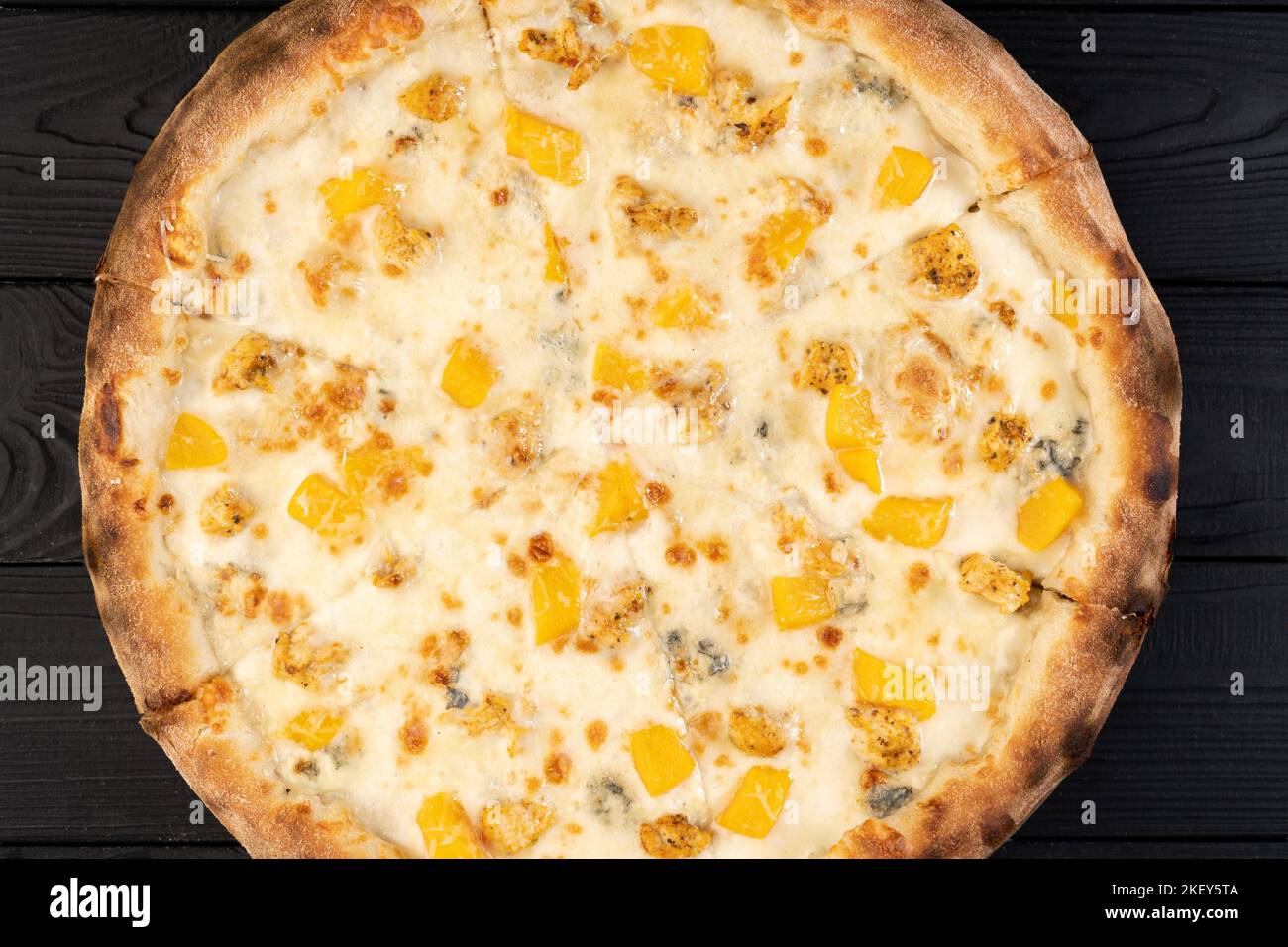 Sweet Gorgonzola pizza with honey and peach on wooden background, top ...