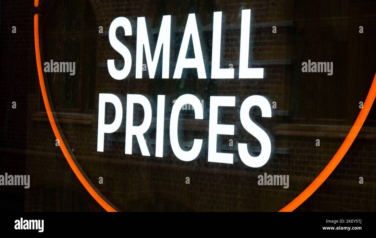 SMALL PRICES inscription in neon lights at night. Electric sign at ...