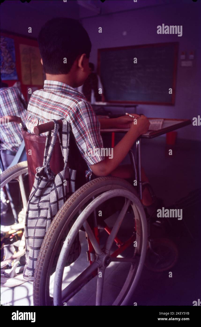 Spastic child on a wheel chair hi-res stock photography and images - Alamy