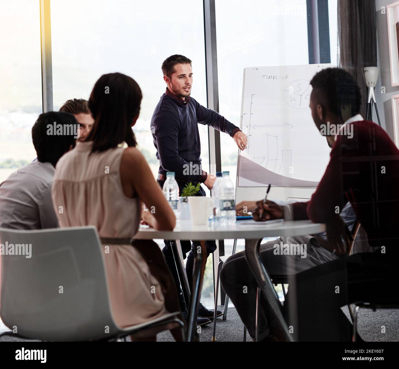 Were turning over a new page. a businessman giving a whiteboard ...