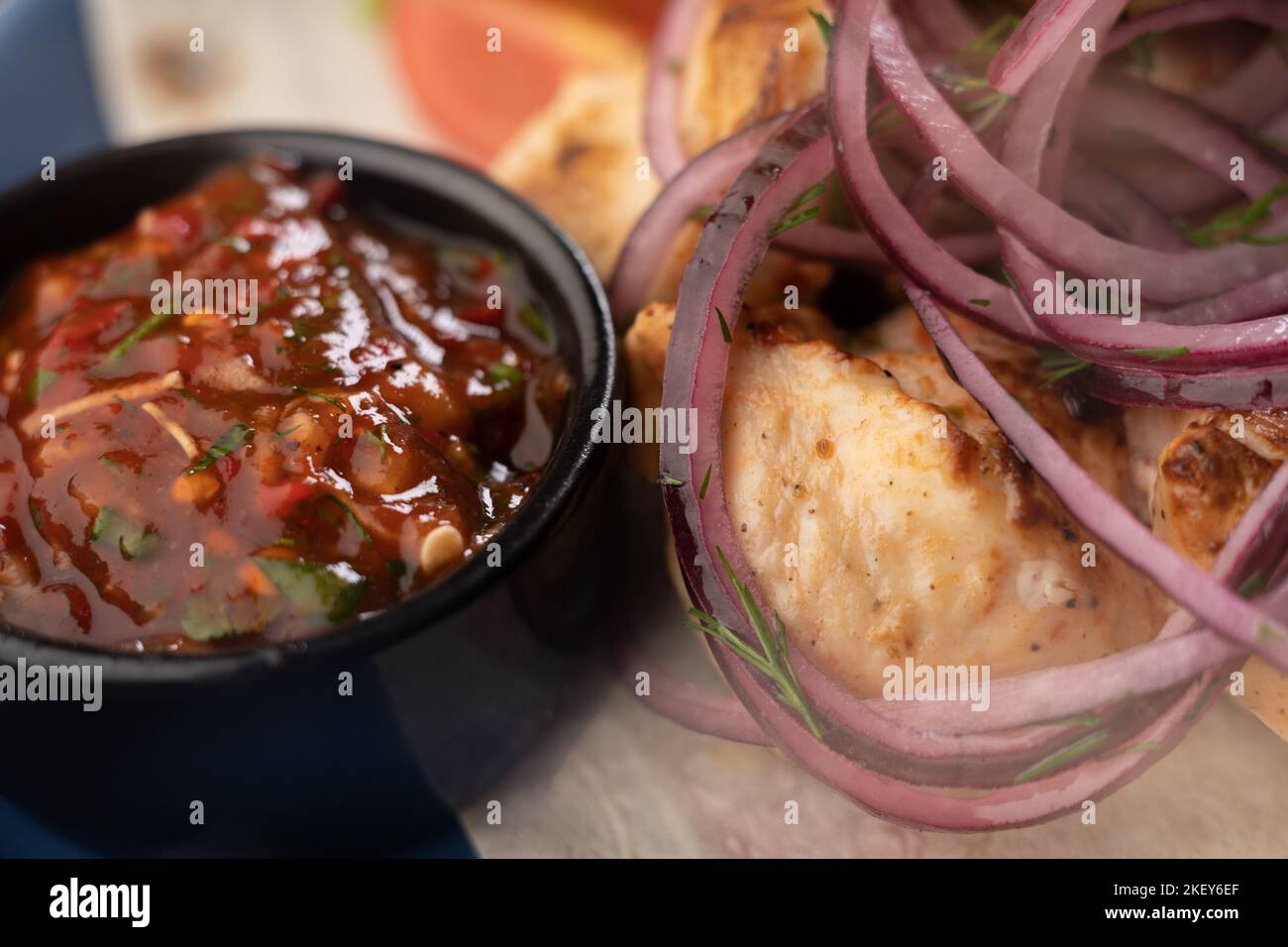 Kebabs background - grilled meat with ketchup, kebab with vegetables on ...