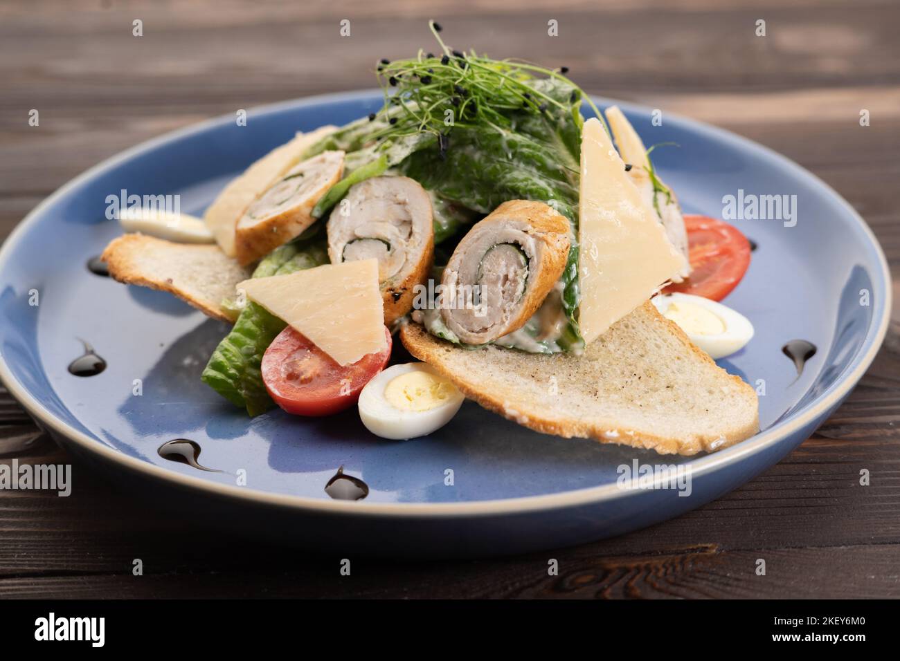 Caesar salad with croutons, quail eggs, cherry tomatoes and grilled ...