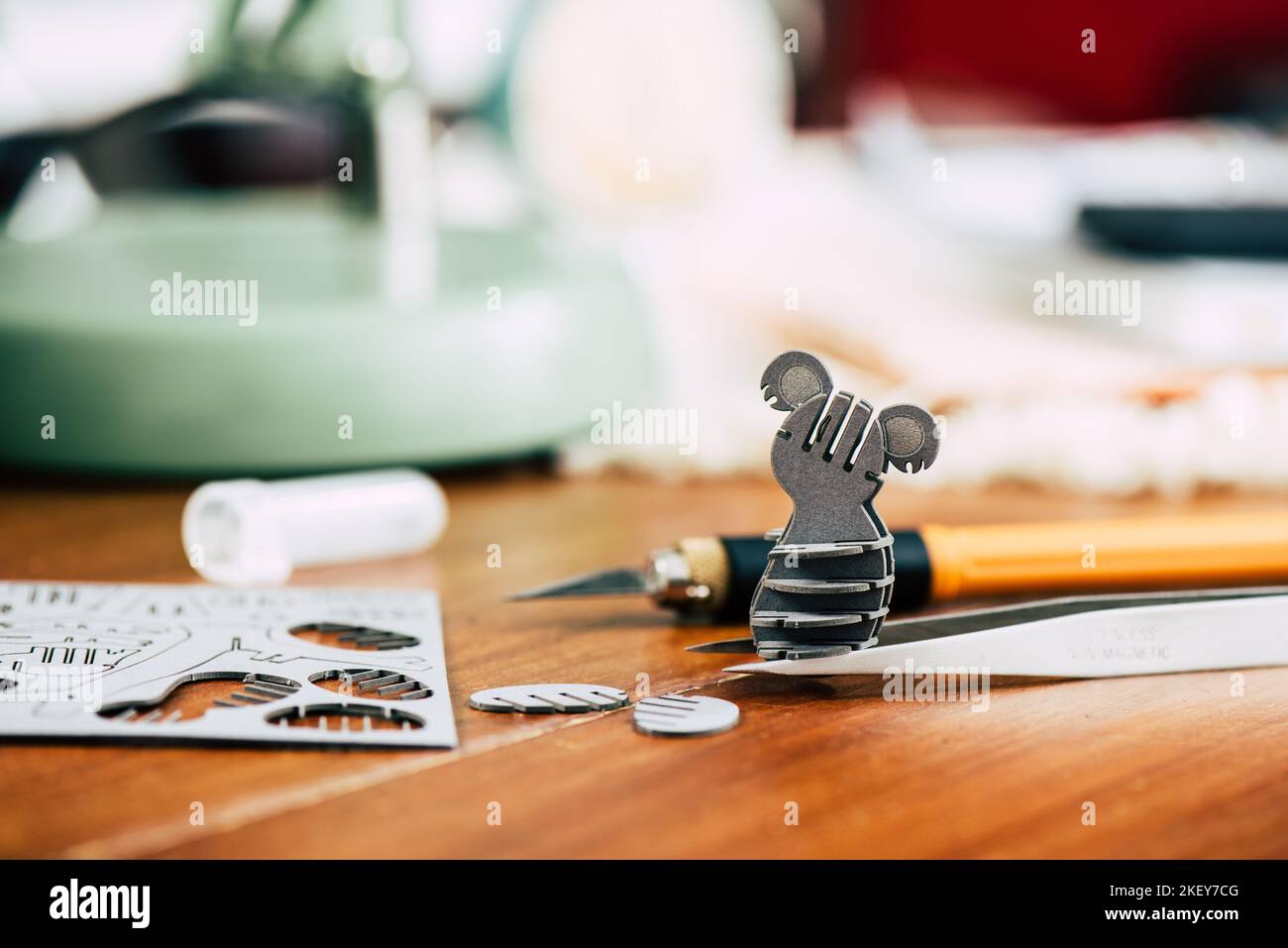 Assembling small cardboard model, the small cardboard parts are made ...