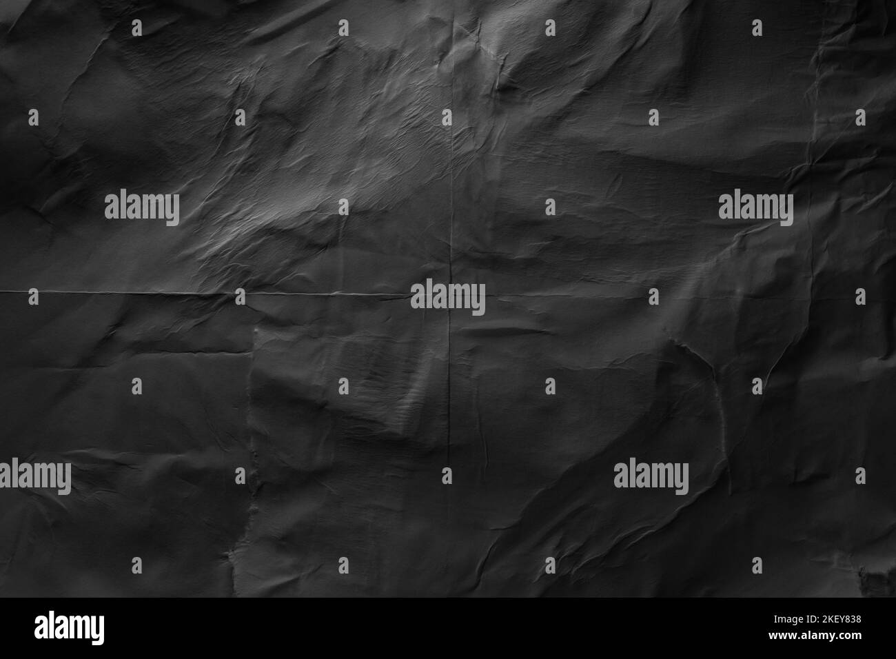 Heavy crumpled black paper texture in low light background Stock Photo ...