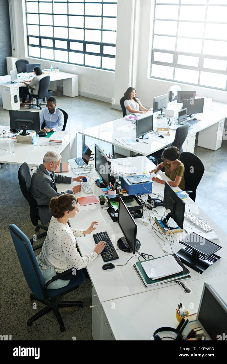 Everyones here to get the job done. High angle shot of a group of ...