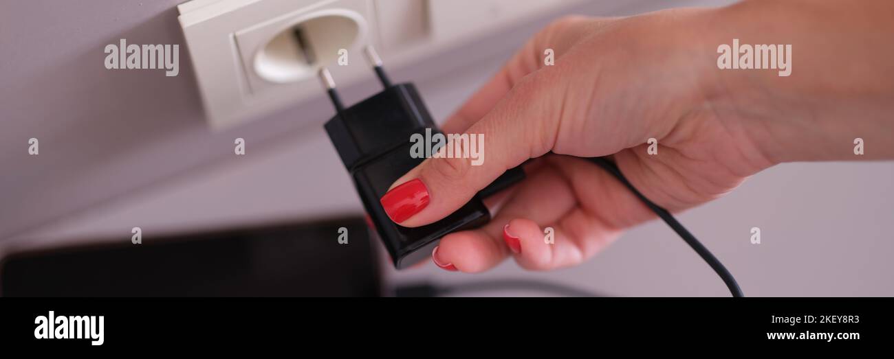Woman plugging smartphone power hi-res stock photography and images - Alamy