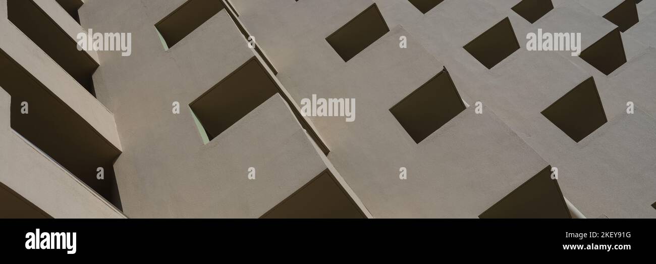 Facade of brown building with square patterns closeup background Stock ...