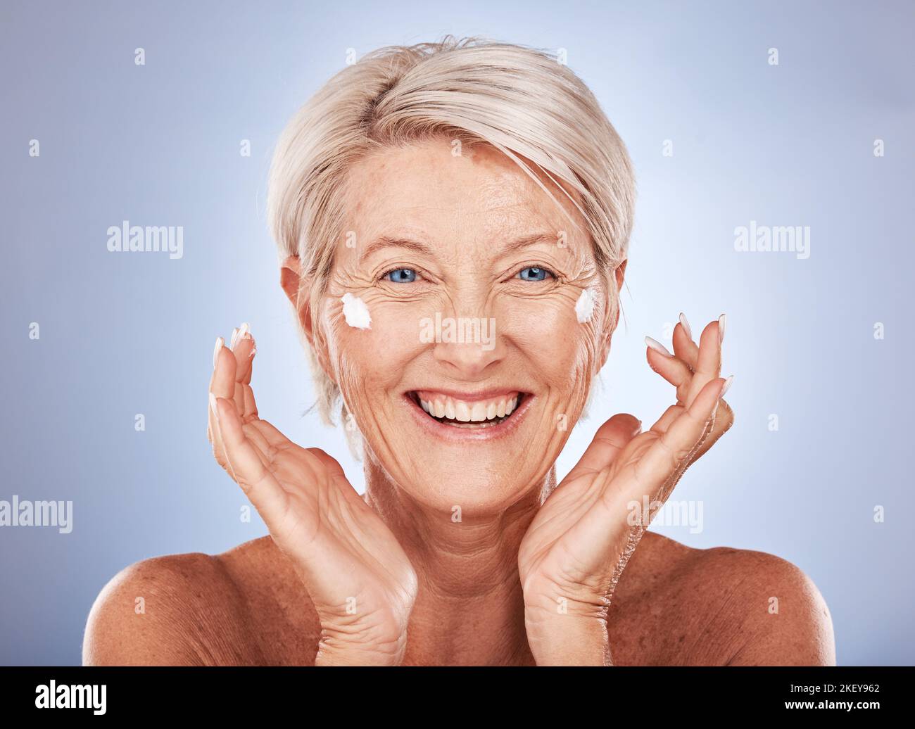Senior woman, face and skincare cream product for grooming on studio ...