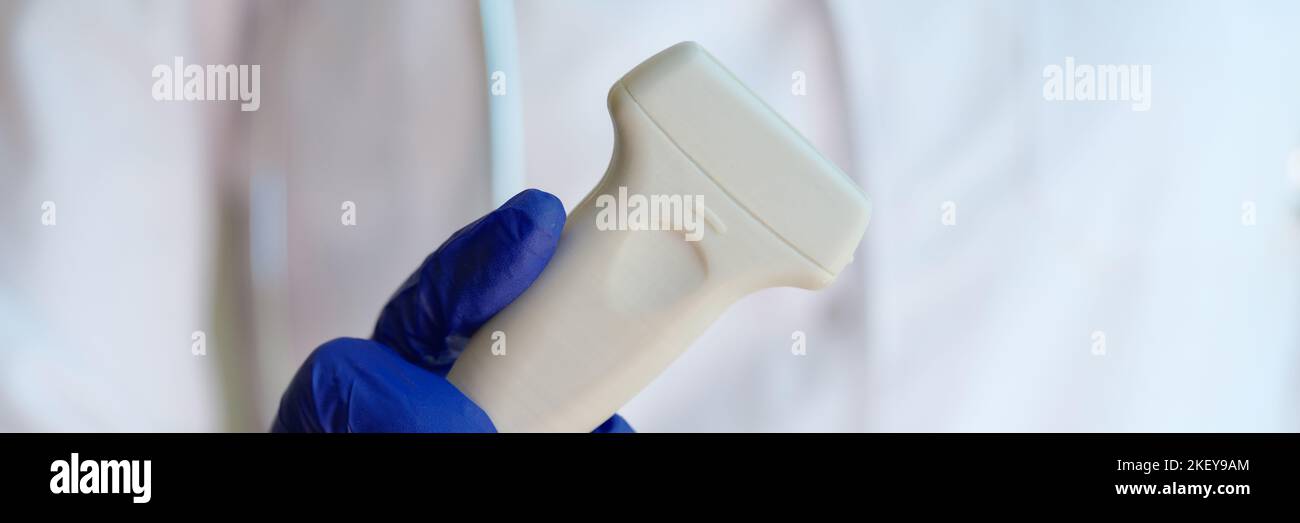 Doctor holds in hand ultrasound probe ultrasound machine Stock Photo ...