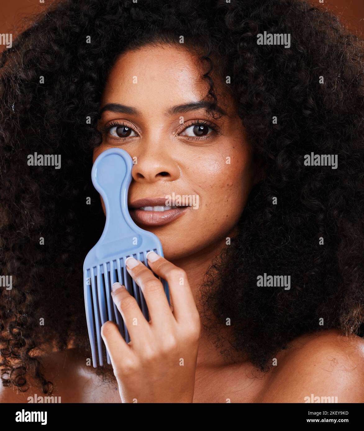 Portrait, black woman and comb for hair care, natural beauty or ...