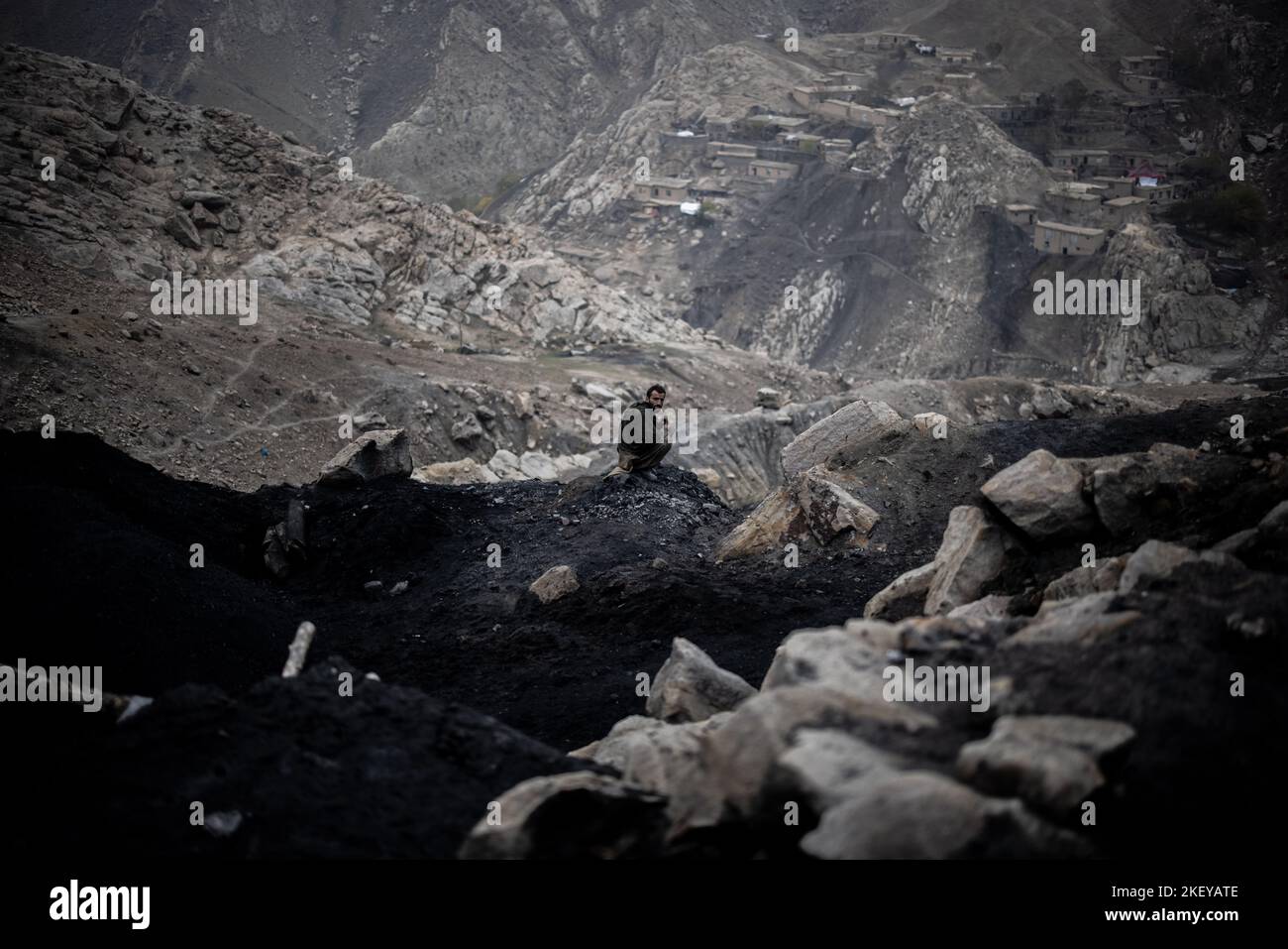 Chinarak, Afghanistan. 12th Nov, 2022. A miner takes a break outside an ...