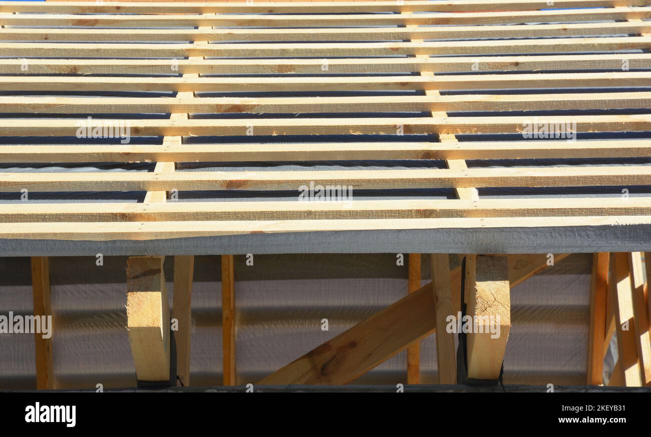Wooden roof frame with copy space. Roofing construction with close up ...