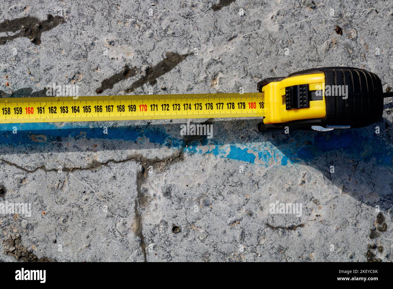 Measuring ruler on a concrete wall texture. The concept of renovation ...