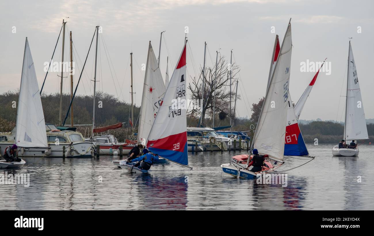 Horning, Norfolk, UK - 13 November 2022. Kids sailing topper boats on ...