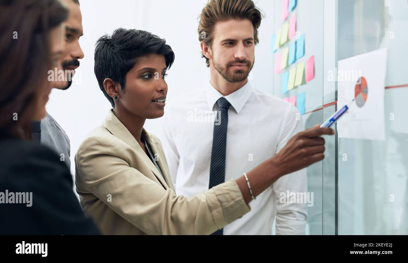 Crunching the numbers together. colleagues brainstorming in the office ...