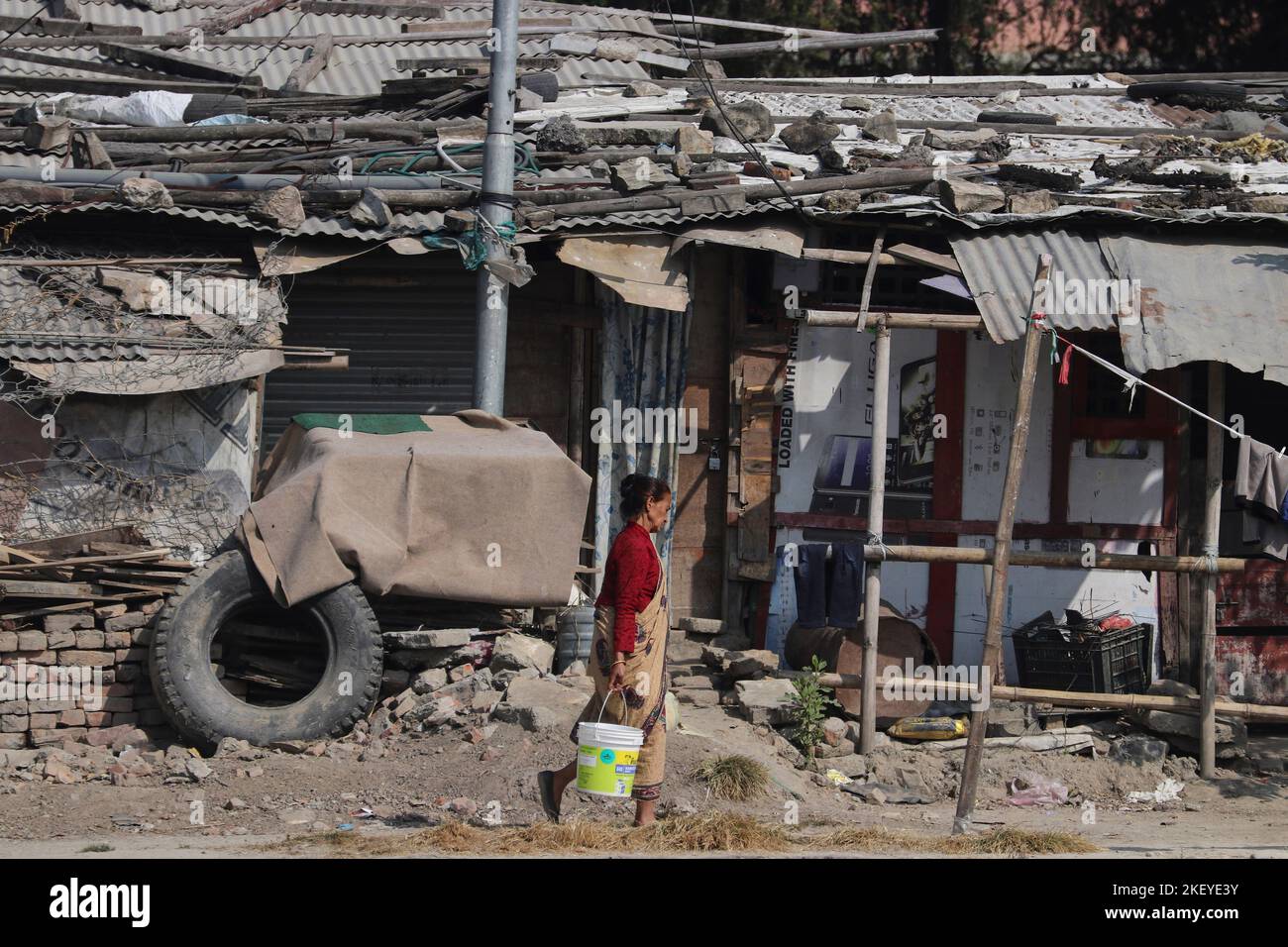Kathmandu, NE, Nepal. 15th Nov, 2022. A woman fetches water in a slum ...
