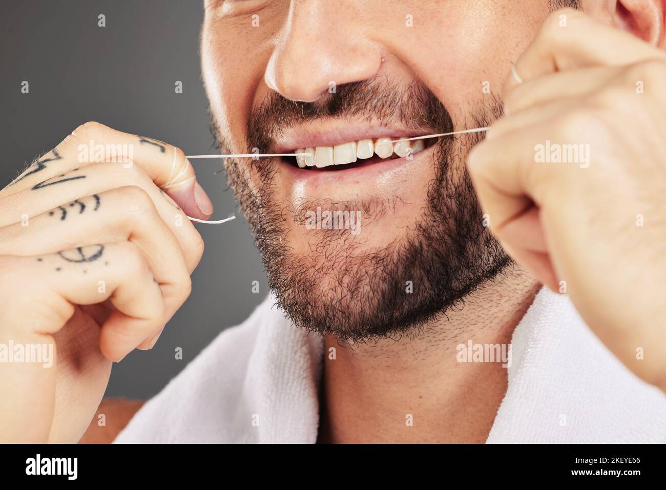 Floss, dental hygiene and man cleaning teeth, for wellness and against ...