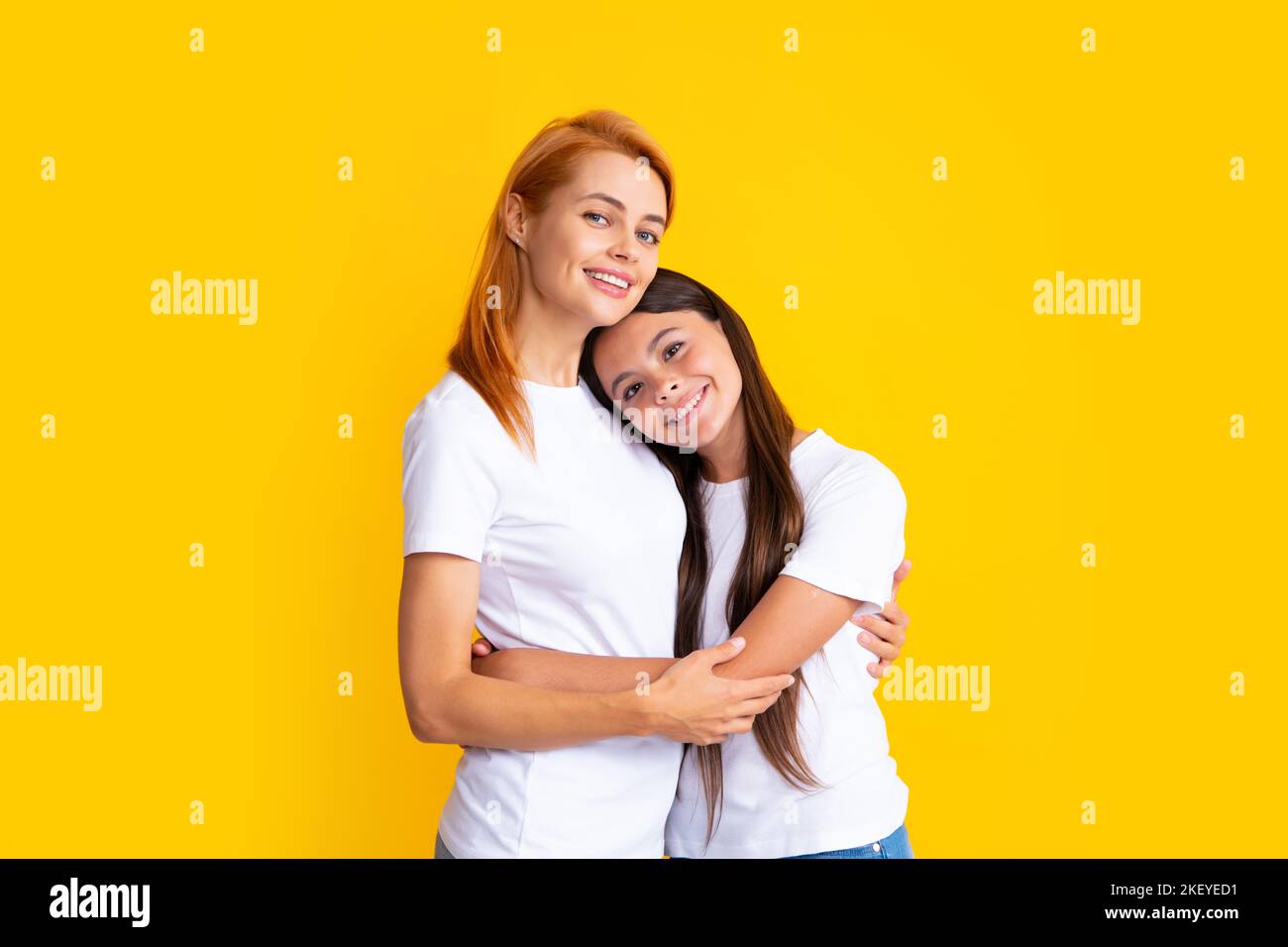 Portrait of child teen girl and mother. Amazing pretty two people mum mom and daughter hugging ...
