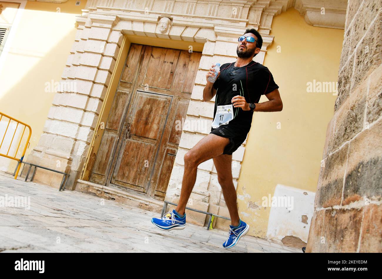 People running during the Ciutadella Half Marathon in Menorca, Spain ...