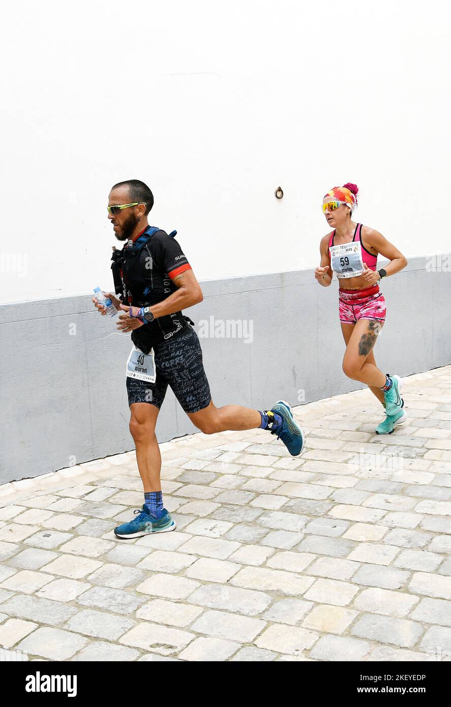 People running during the Ciutadella Half Marathon in Menorca, Spain ...