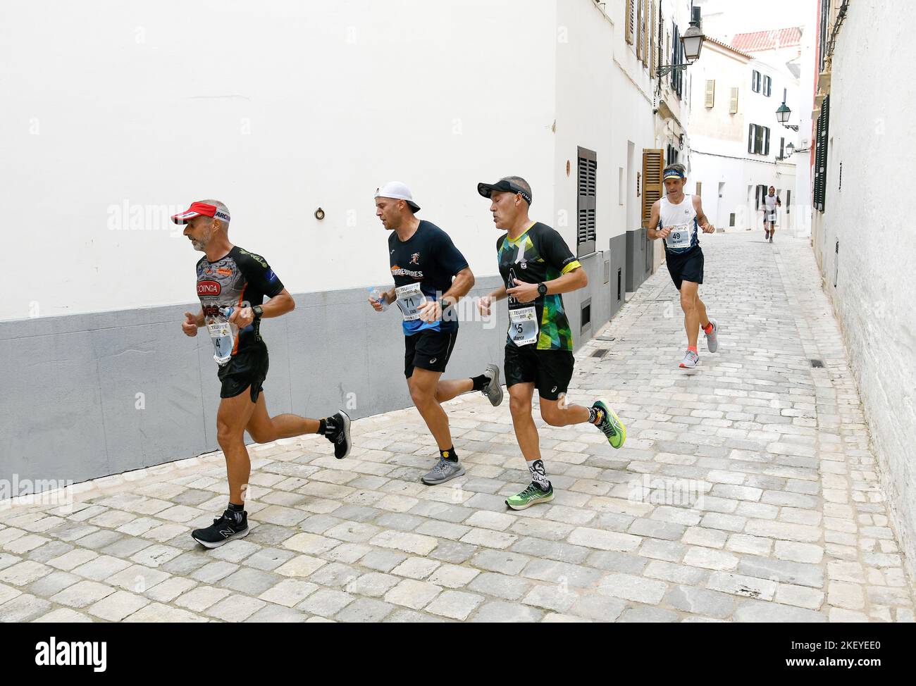 People running during the Ciutadella Half Marathon in Menorca, Spain ...