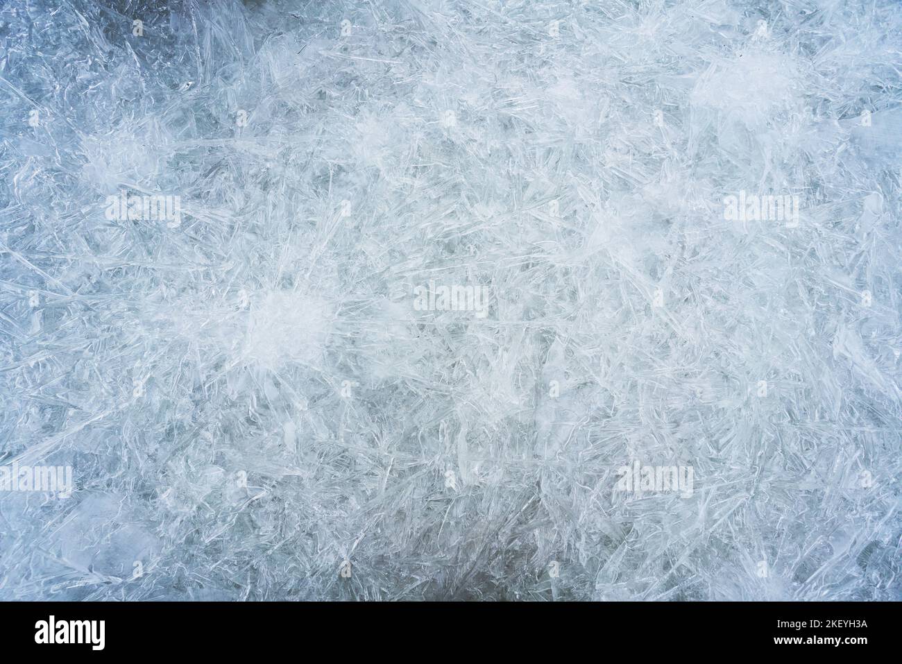 Fresh ice surface texture. Winter background with frozen snowflakes and ...