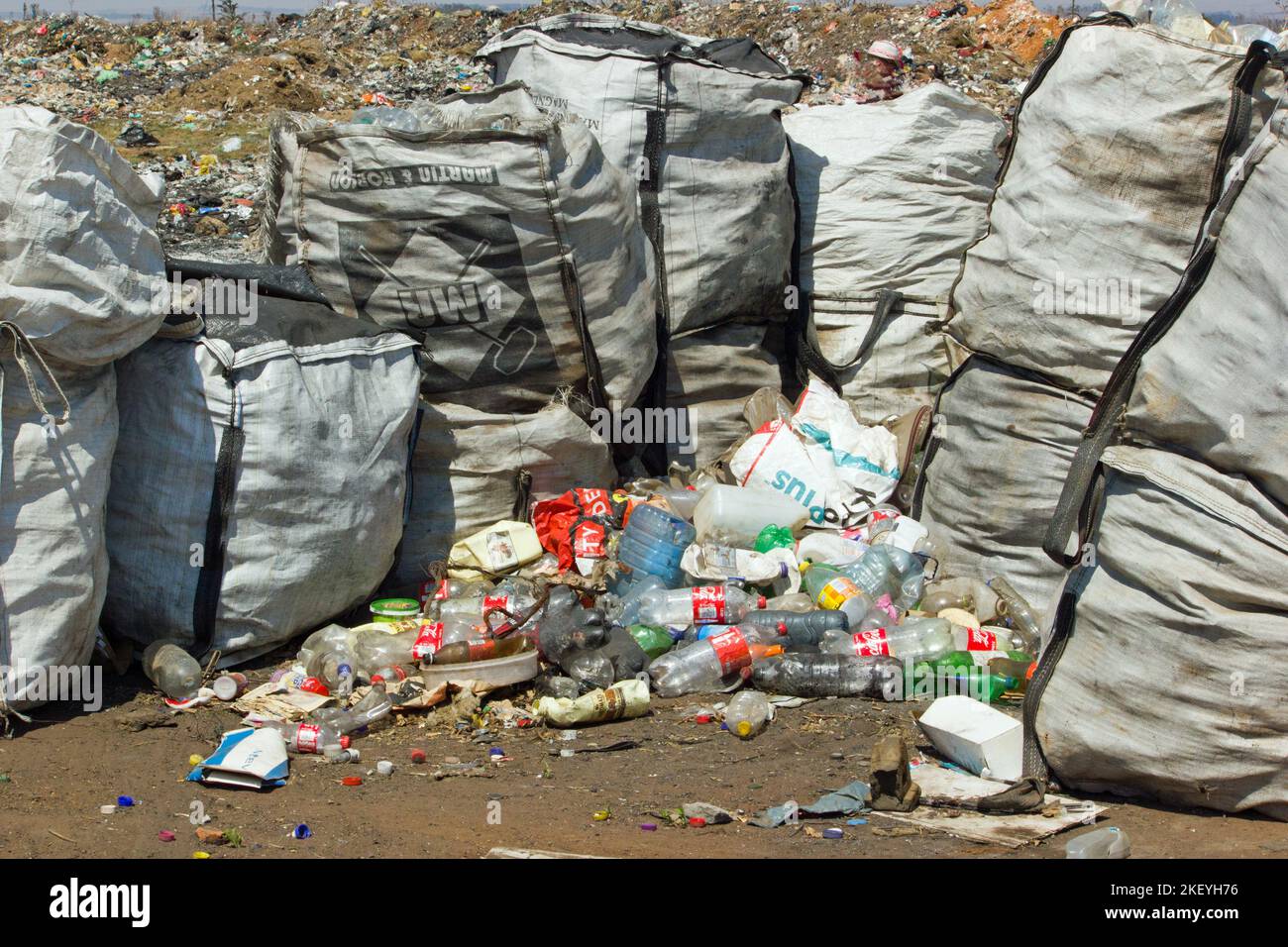 stock photo of garbage collection bags and empty plastic bottles on ...