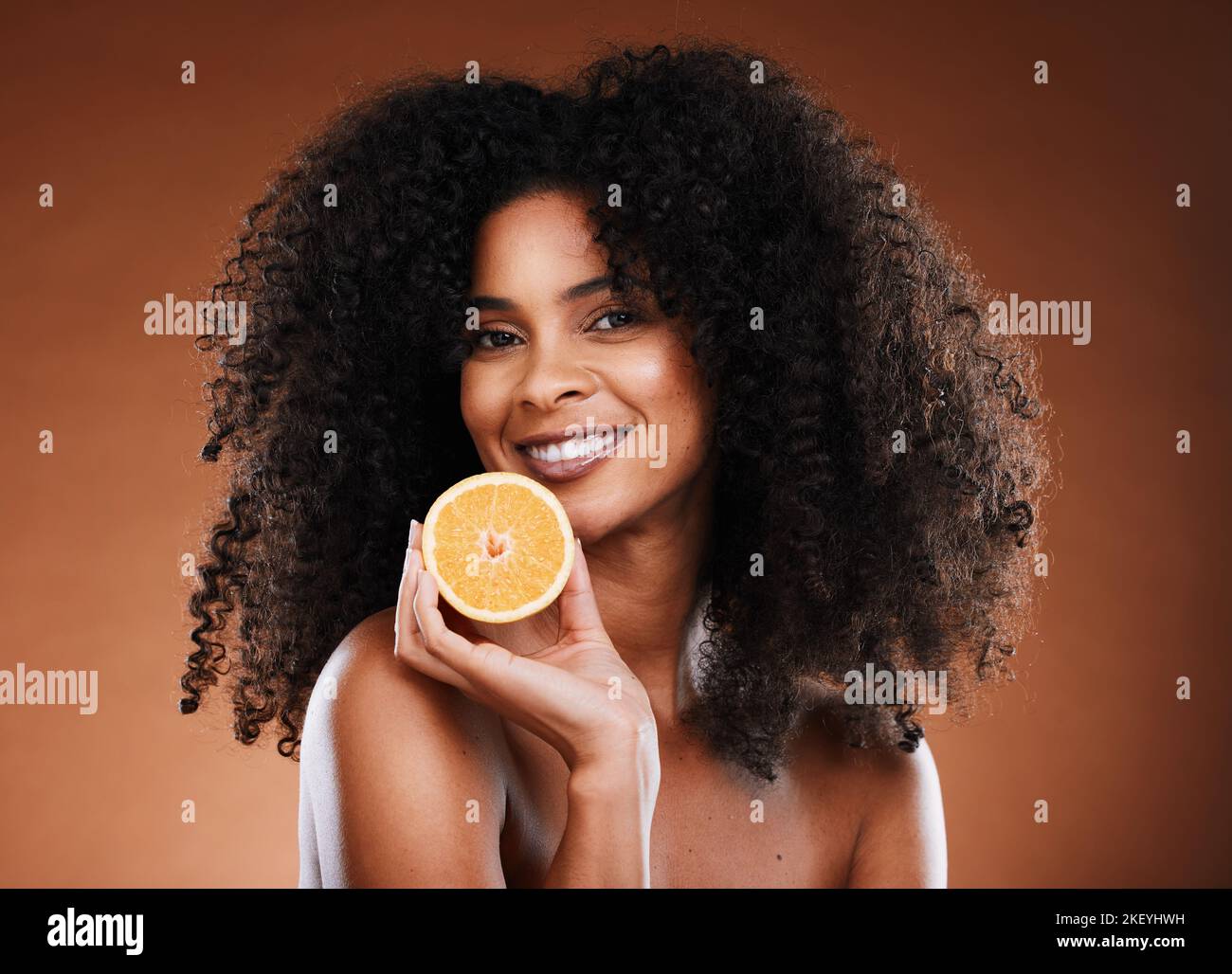 Orange, health and face of a black woman with fruit for skincare ...