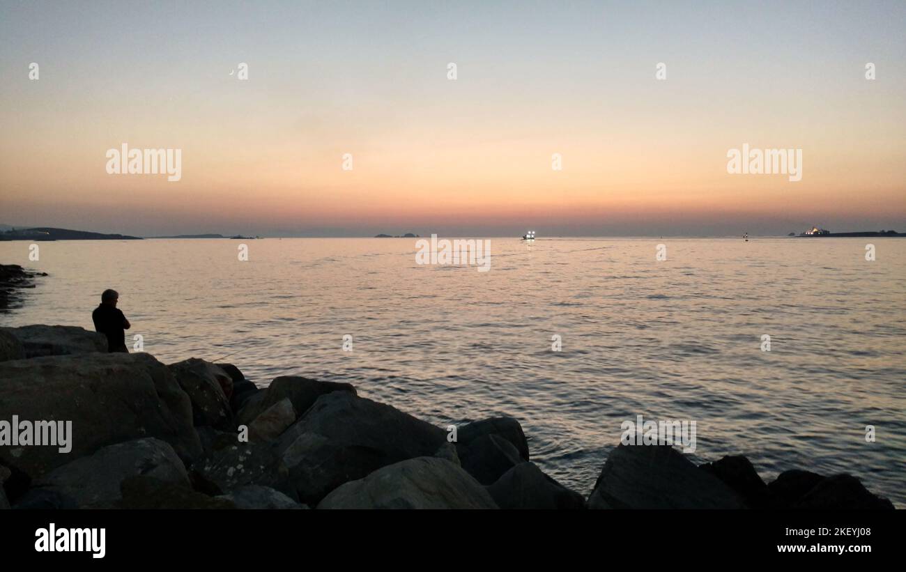 fishermen Angler sunset Paros Greece mediteranean island aegean Stock ...