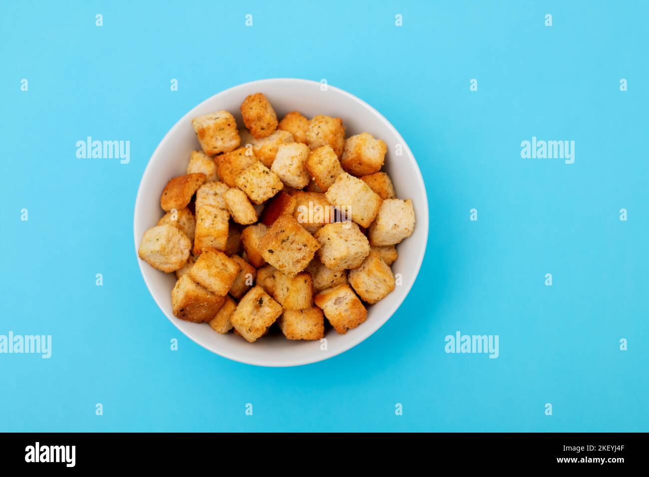 Crispy dry cubes of white bread in white bowl Stock Photo - Alamy