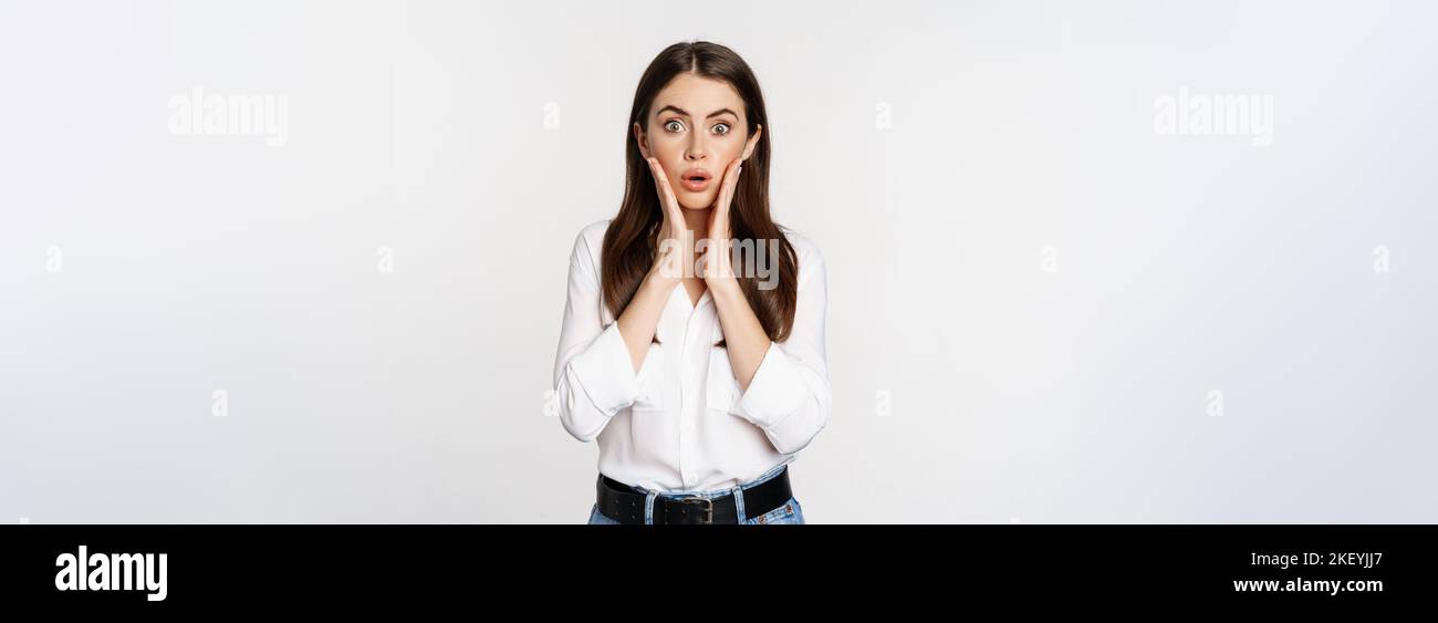 Portrait of concerned female model looking shocked, surprised face ...