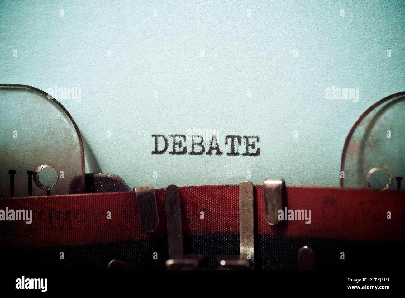 Debate word written with a typewriter Stock Photo - Alamy