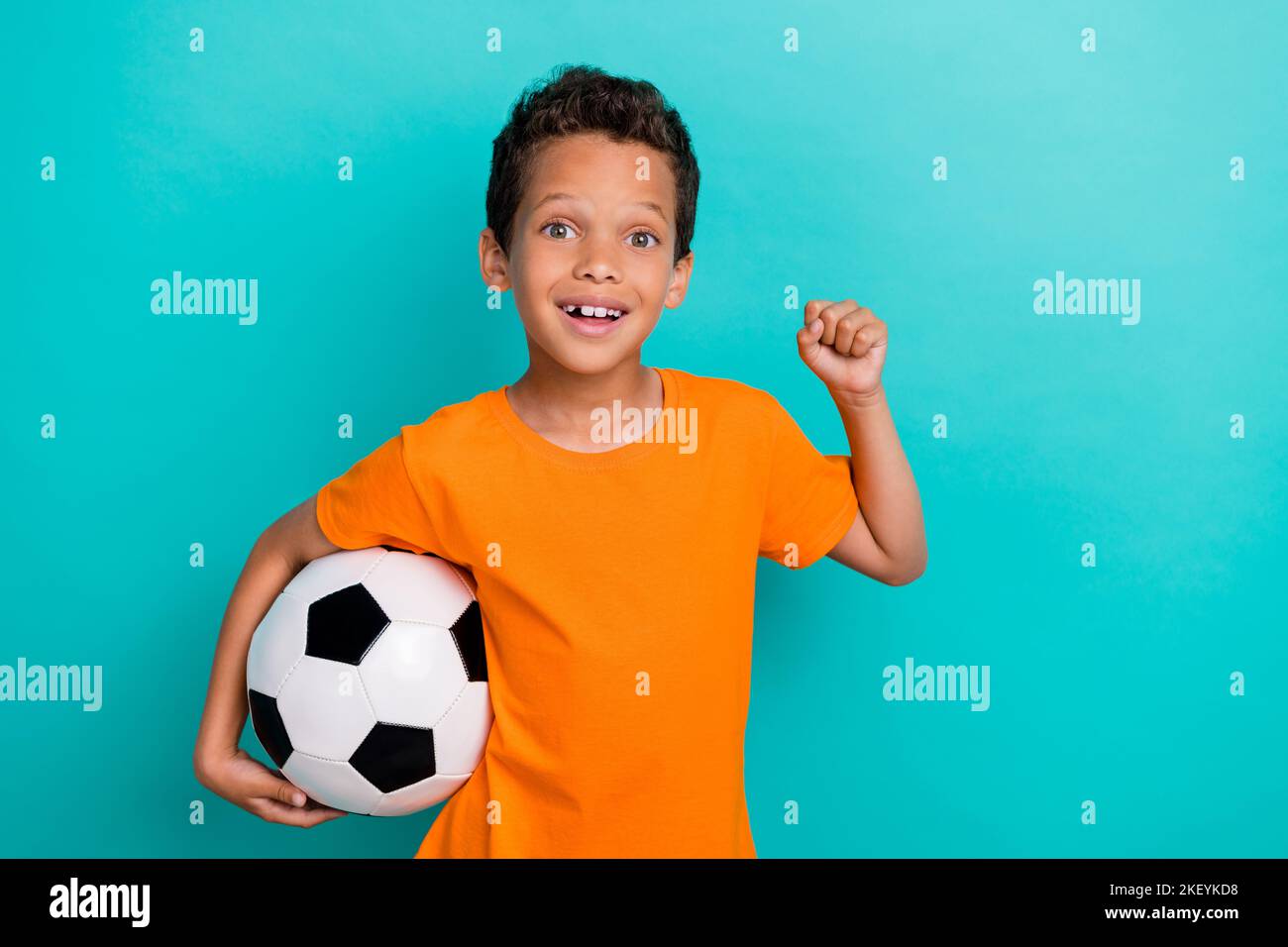 Photo of sweet lucky little guy dressed orange t-shirt catching ...