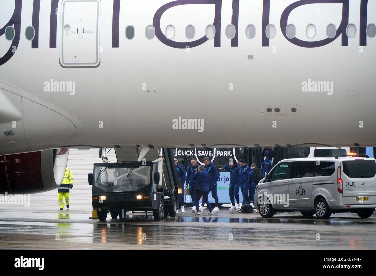 England players, including captain Harry Kane, boarding a Virgin ...