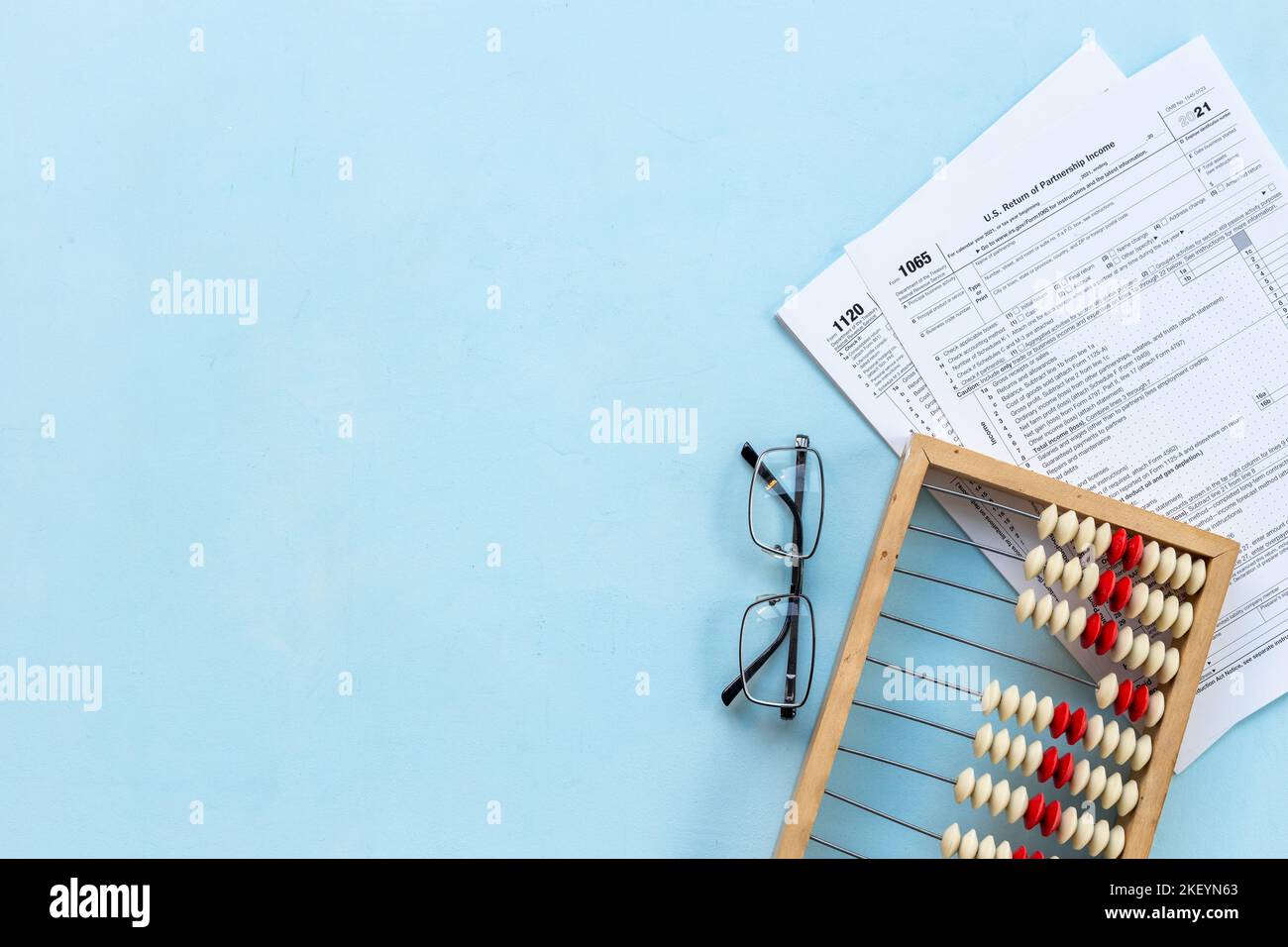 Business tax calculations with accounting wooden abacus Stock Photo - Alamy