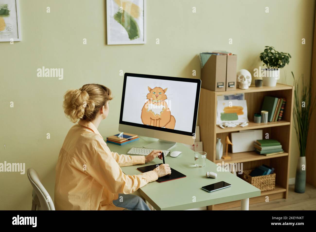 Desktop computer with fat ginger cat drawn by young creative digital ...