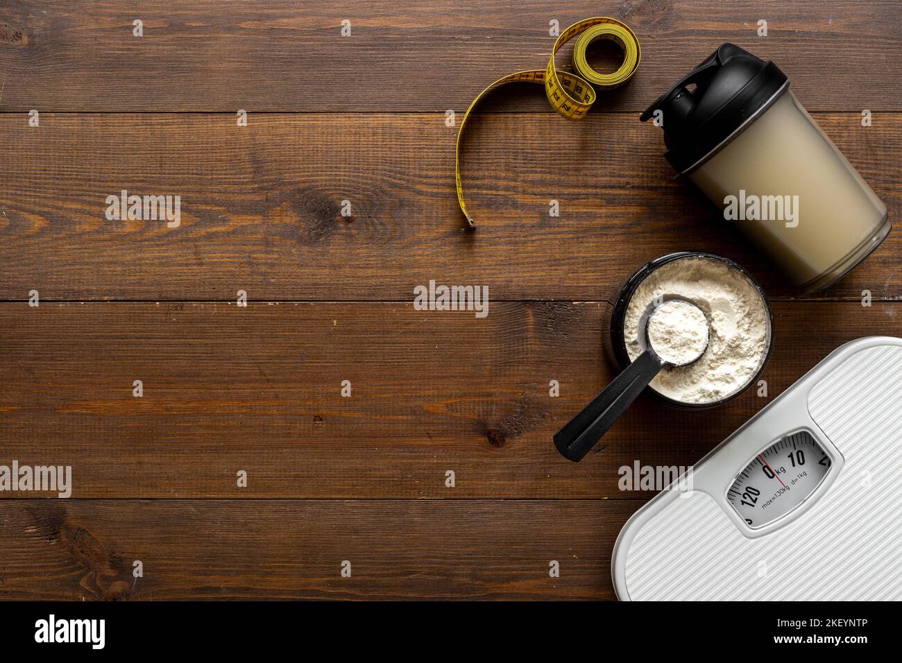 Whey protein powder in jar and scales. Fitness and gym food diet Stock ...