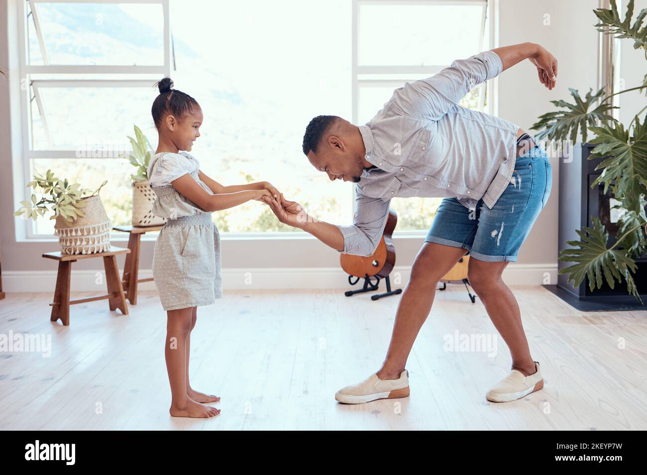 Happy family, dance and dad and child holding hands, bond and enjoy fun ...