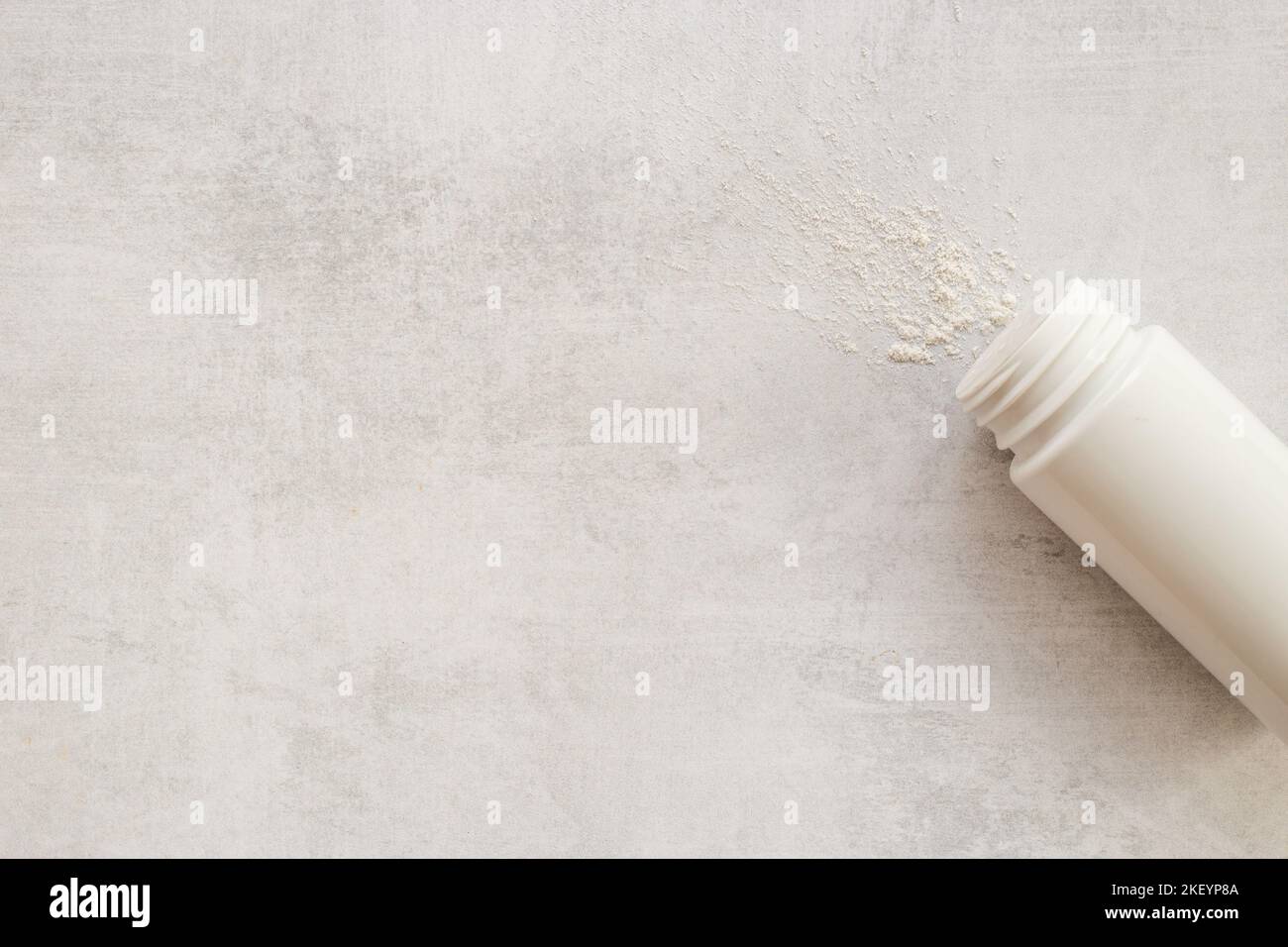 Skin care with talcum powder in container. Spilled white powder Stock ...