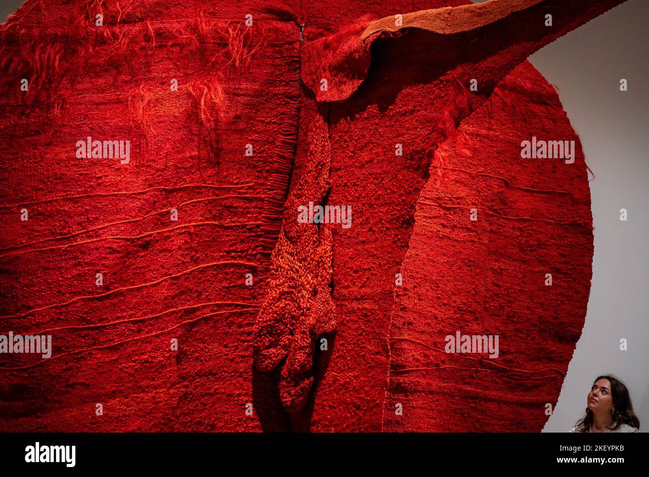 A gallery assistant looks at Abakan Red, large-scale Abakan sculptures ...