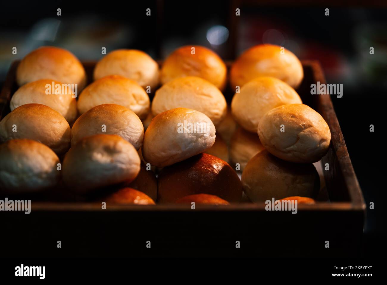 Hot Fresh Baked Bread Rolls in a wooden box for the customer, the stack ...
