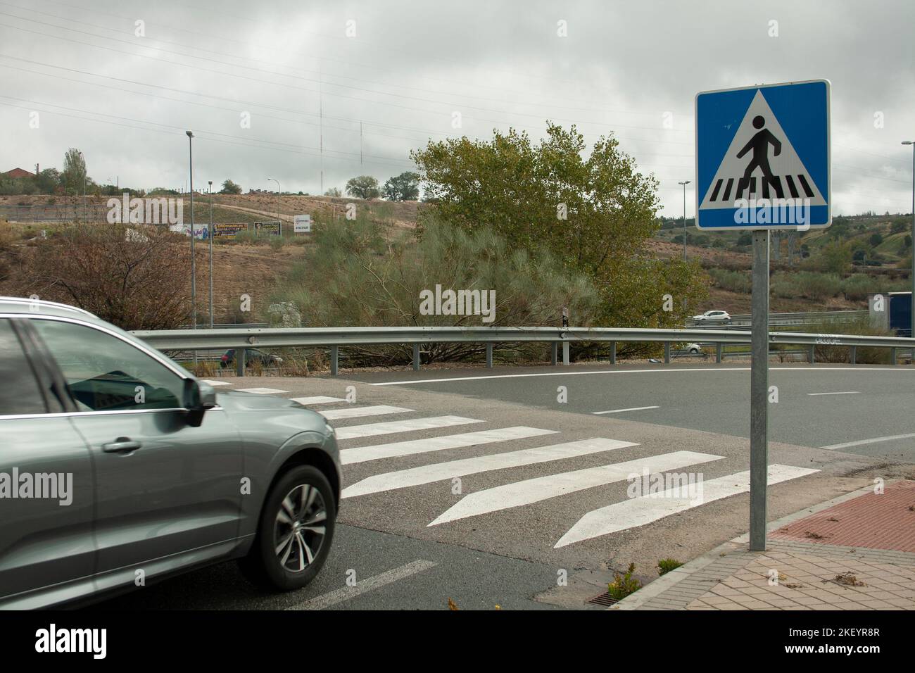 zebra crossing, sign of the same both vertical and horizontal on a road ...