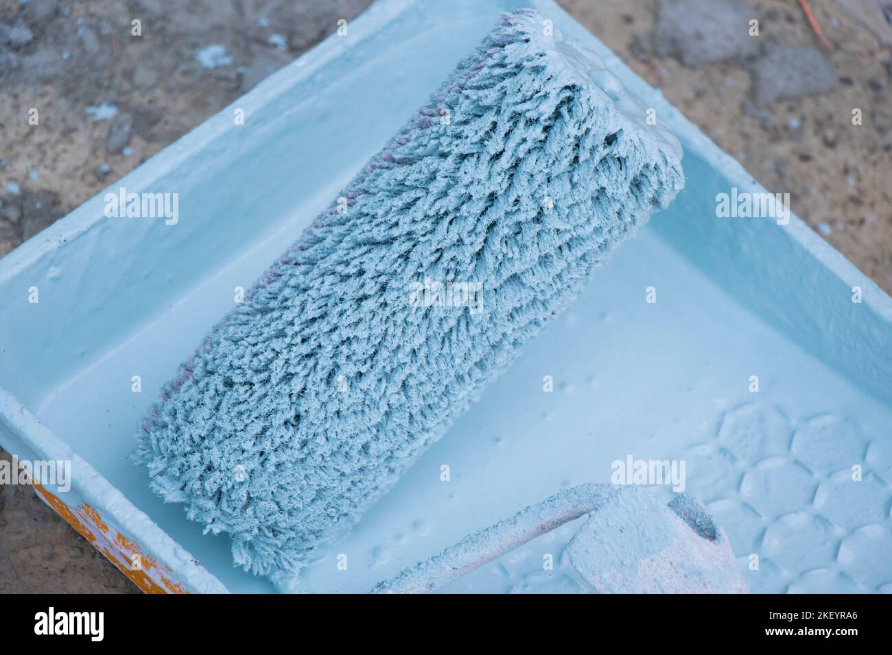 close-up of blue color paint and paint roll Stock Photo - Alamy