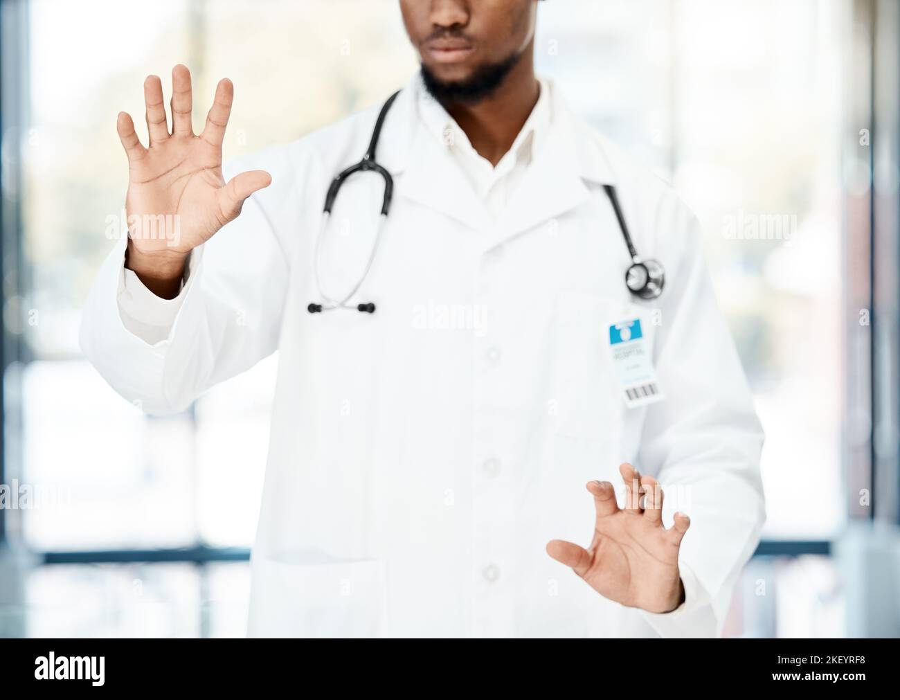 Hands, healthcare and us with a black man doctor using a touchscreen ...