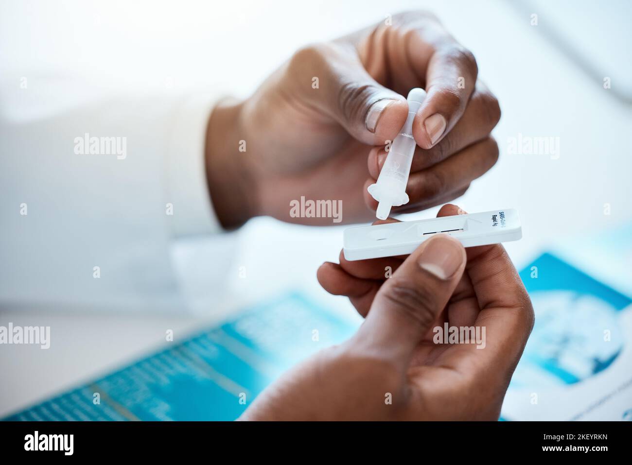 Hands, covid and doctor with antigen test in hospital for healthcare ...